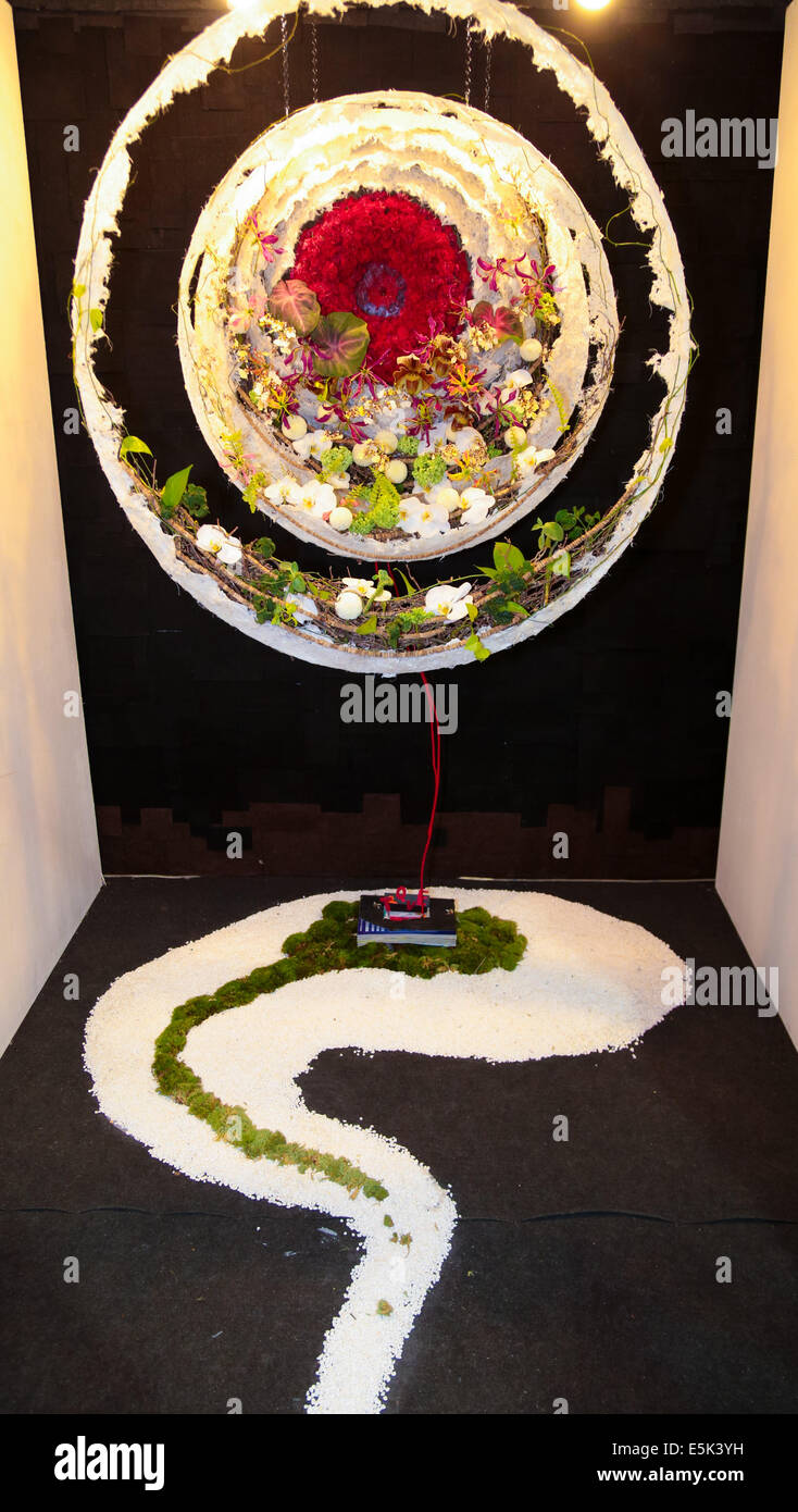 Flower arrangements depiciting knowledge grow from book at FLORIA event ...
