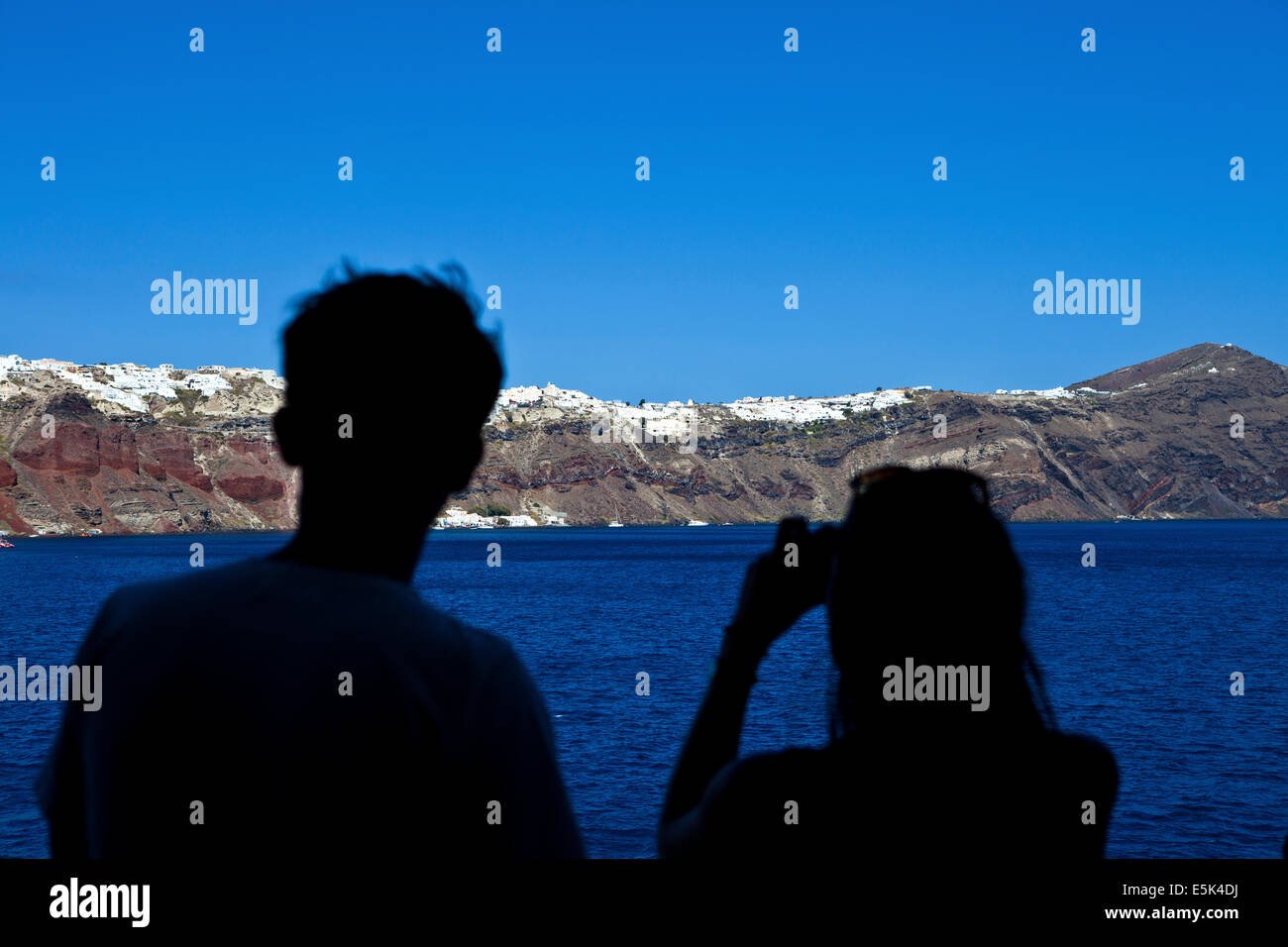 Tourist Taking picture of Ia (oia) Santorini from a cruise ship Stock ...