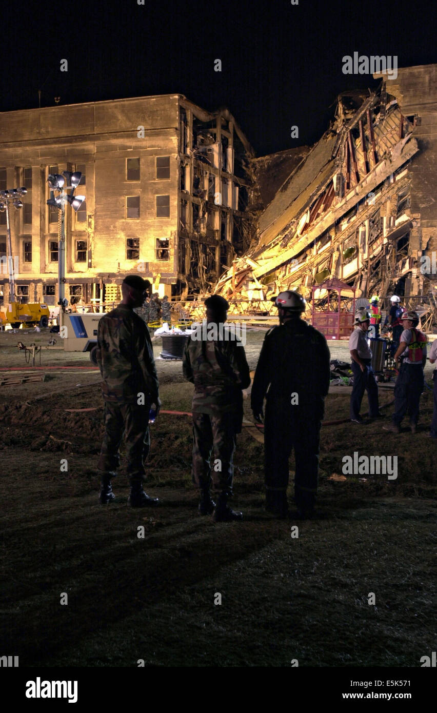 Search and Rescue workers view the collapsed exterior of the Pentagon ...