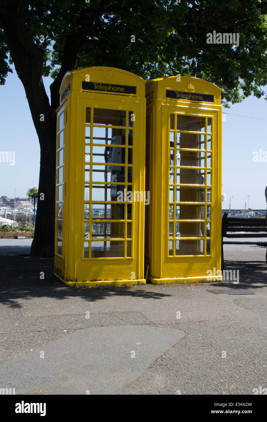 Two yellow telephone boxes in St Peter's Port, Guernsey Stock Photo - Alamy