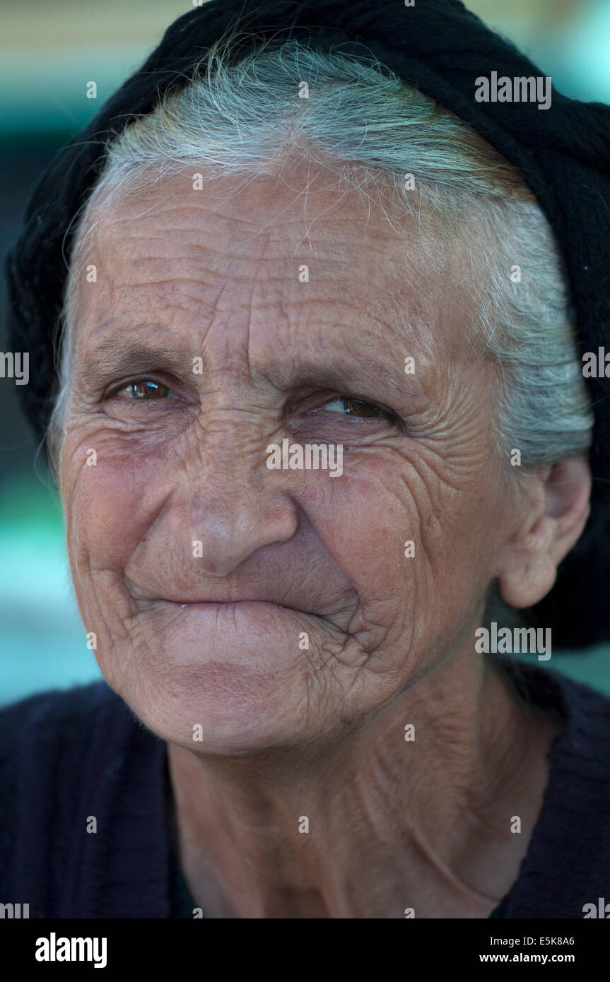 Old woman with traditional kerchief at the market, Stepanakert ...