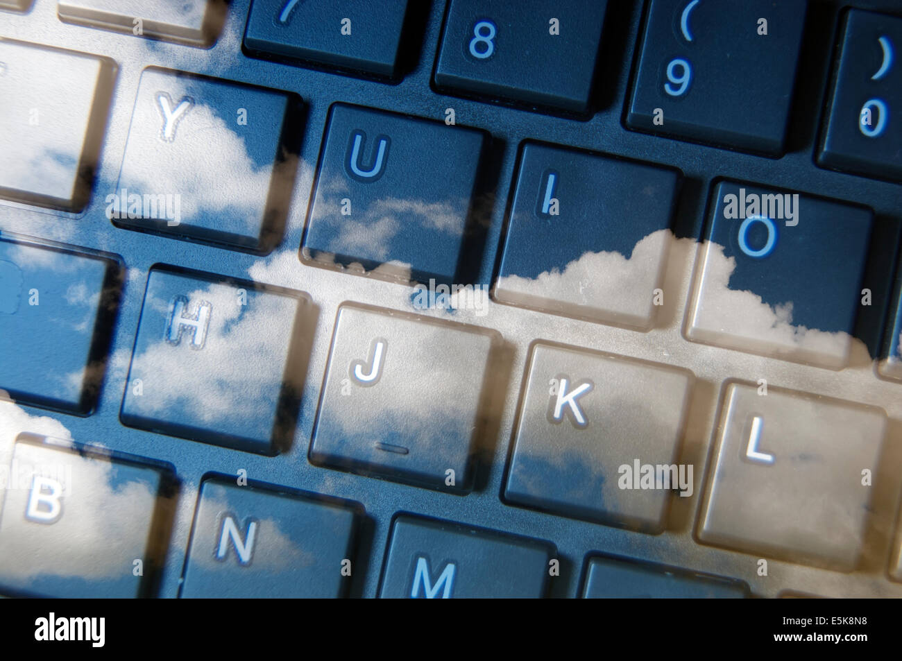 cloud computing. A keyboard over a cloud representing the concept of ...