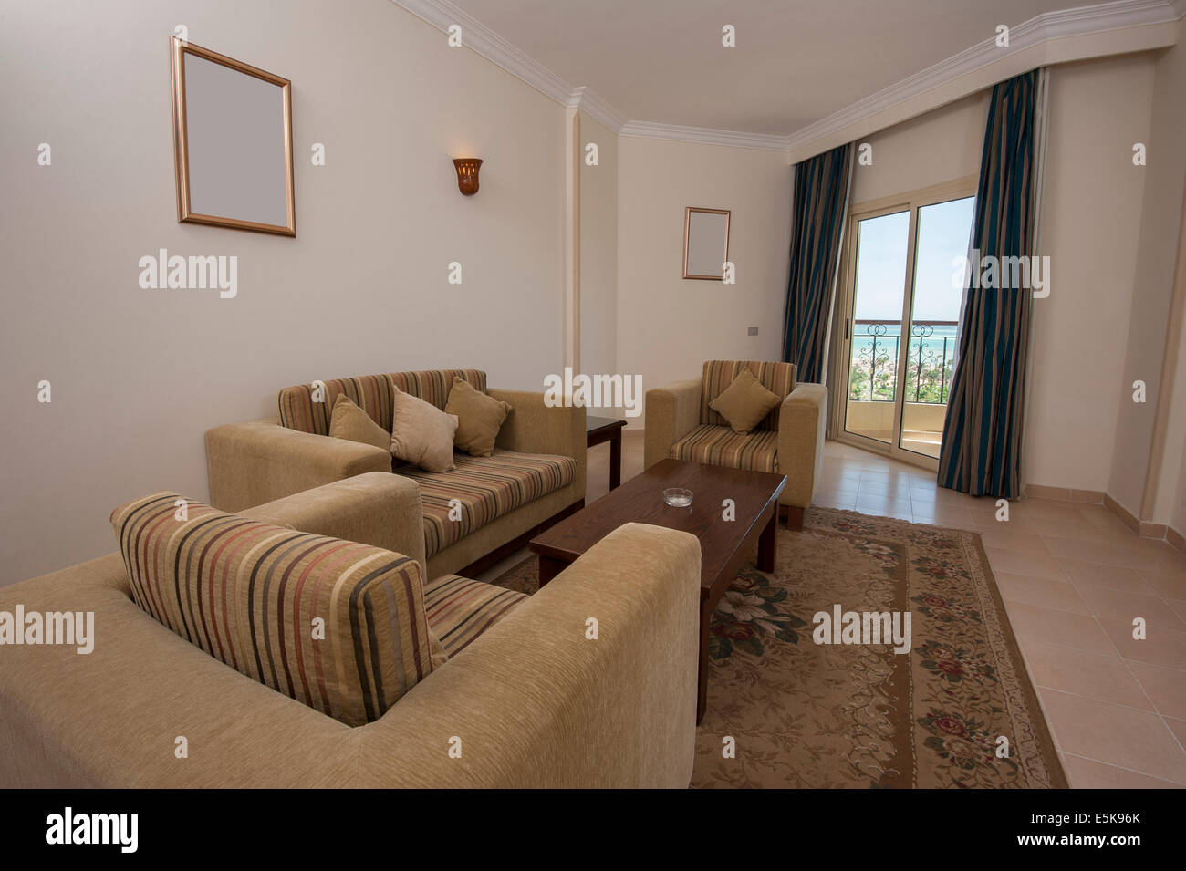 Lounge area of hotel suite room with view over tropical sea Stock Photo ...
