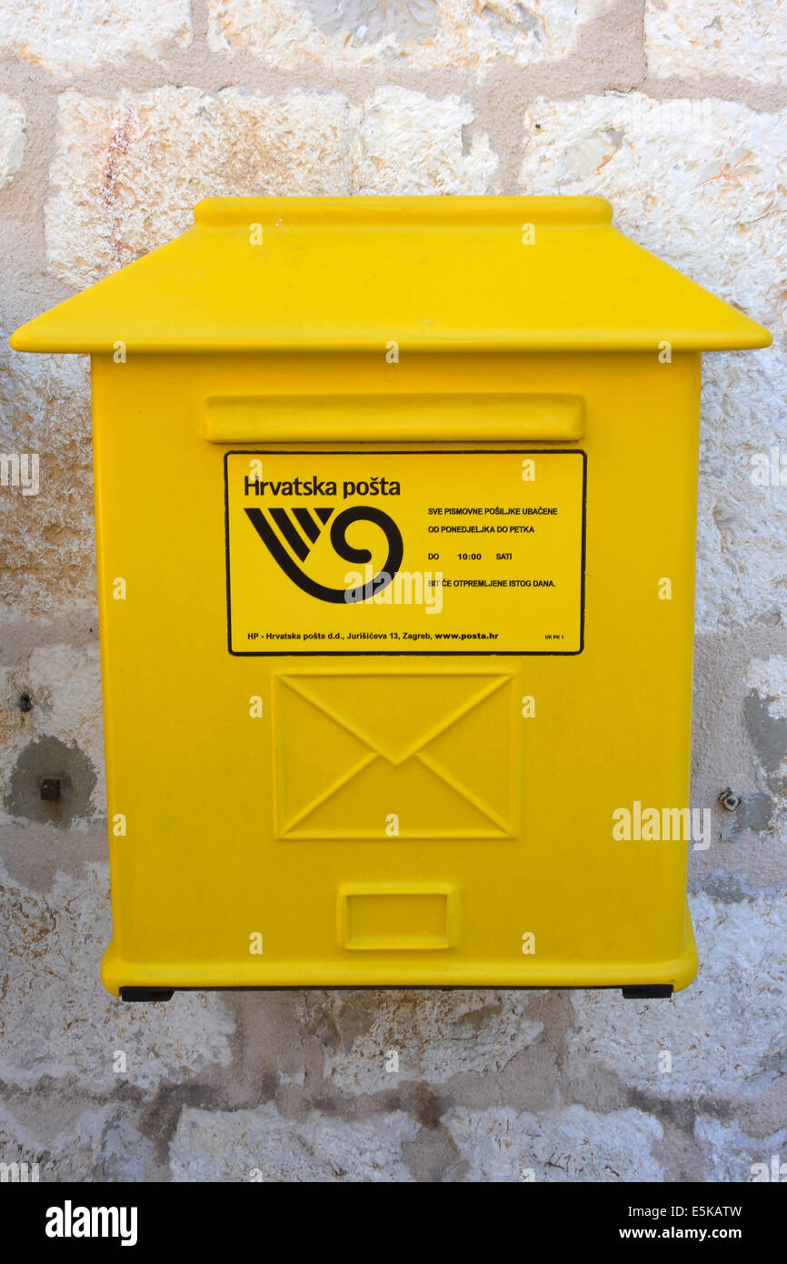Yellow wall mounted post box in town centre Dubrovnik Croatia Dalmatia ...