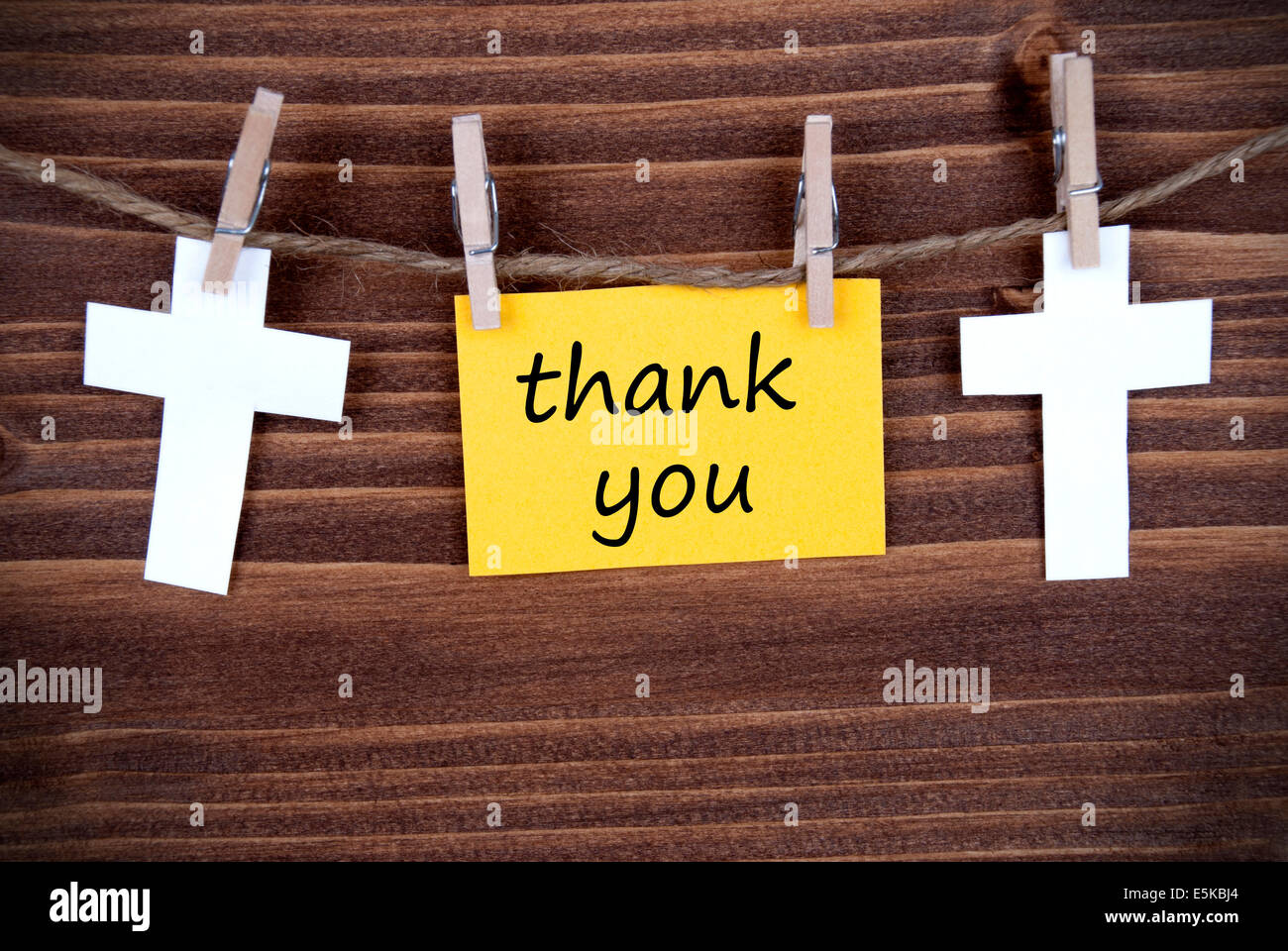 Yellow Label with the Words Thank You and two white Crosses on a Line ...