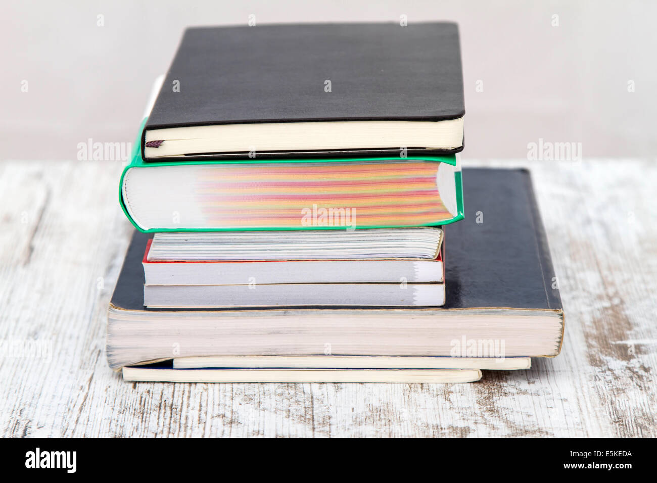 A pile of books over a table Stock Photo - Alamy