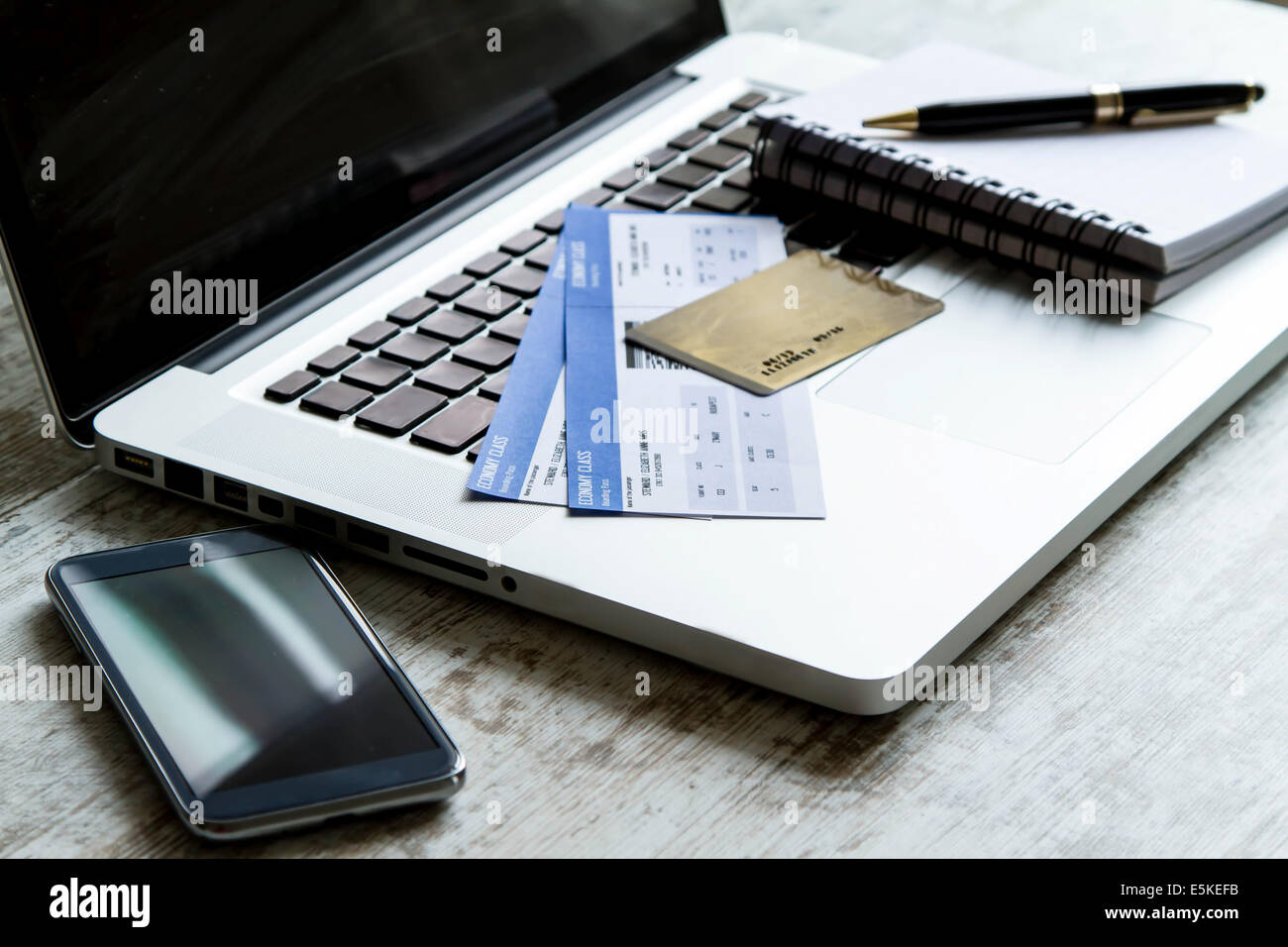 Buying airline tickets on line with a credit card Stock Photo - Alamy