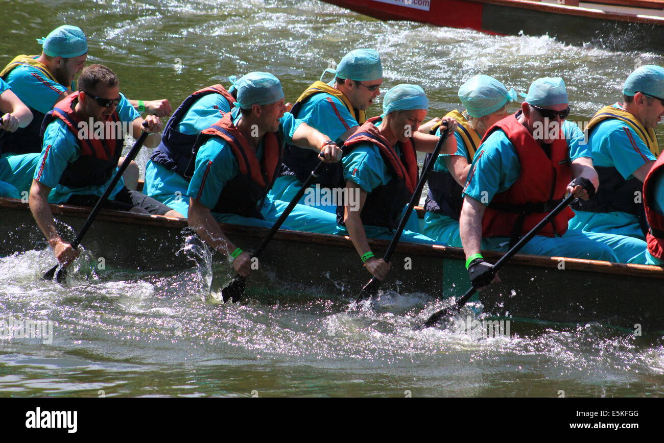 Dragon boat crew dressed as surgeons Stock Photo - Alamy