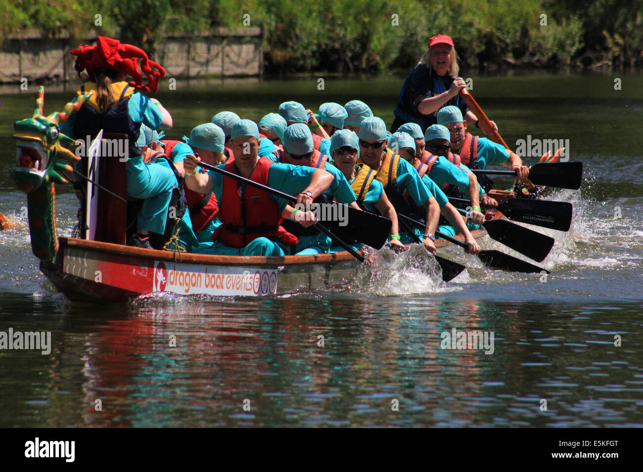 Dragon boat crew dressed as surgeons Stock Photo - Alamy