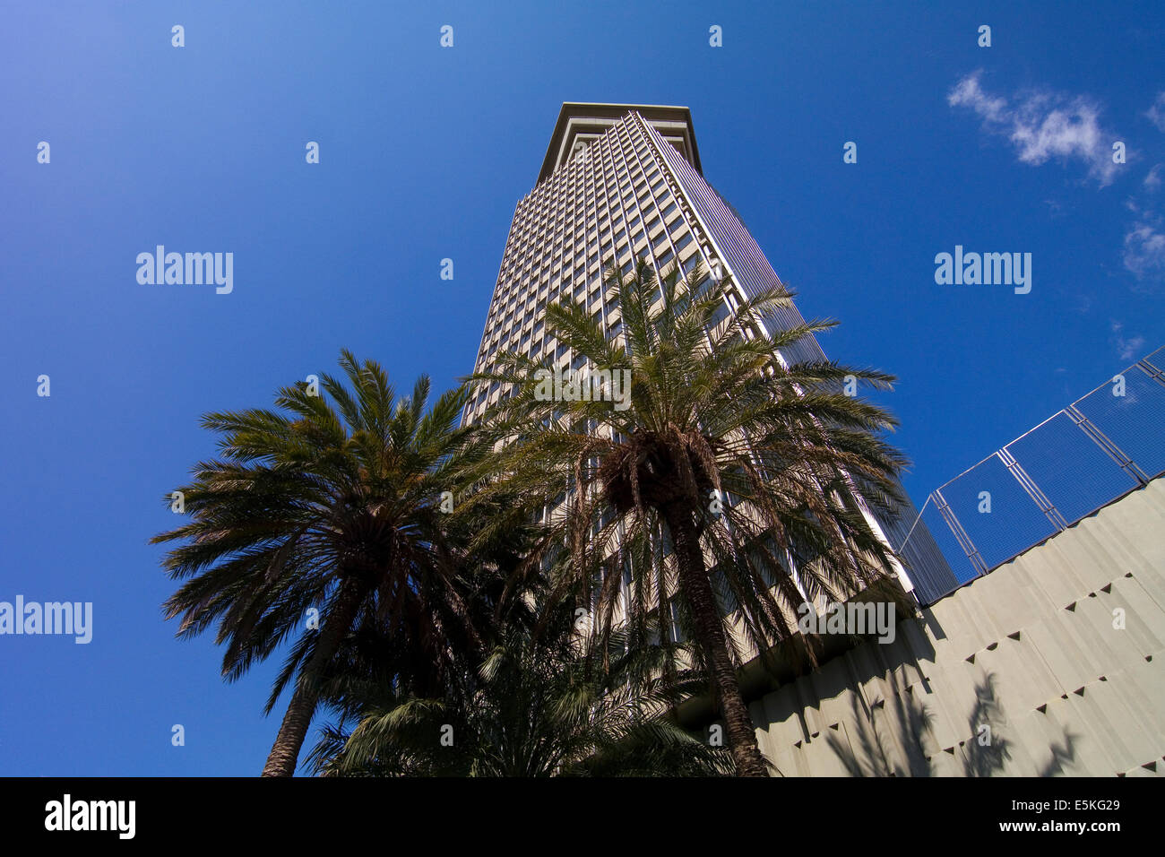 Edifici Colón or Mariners Tower with palm trees in Barcelona, Catalunia ...