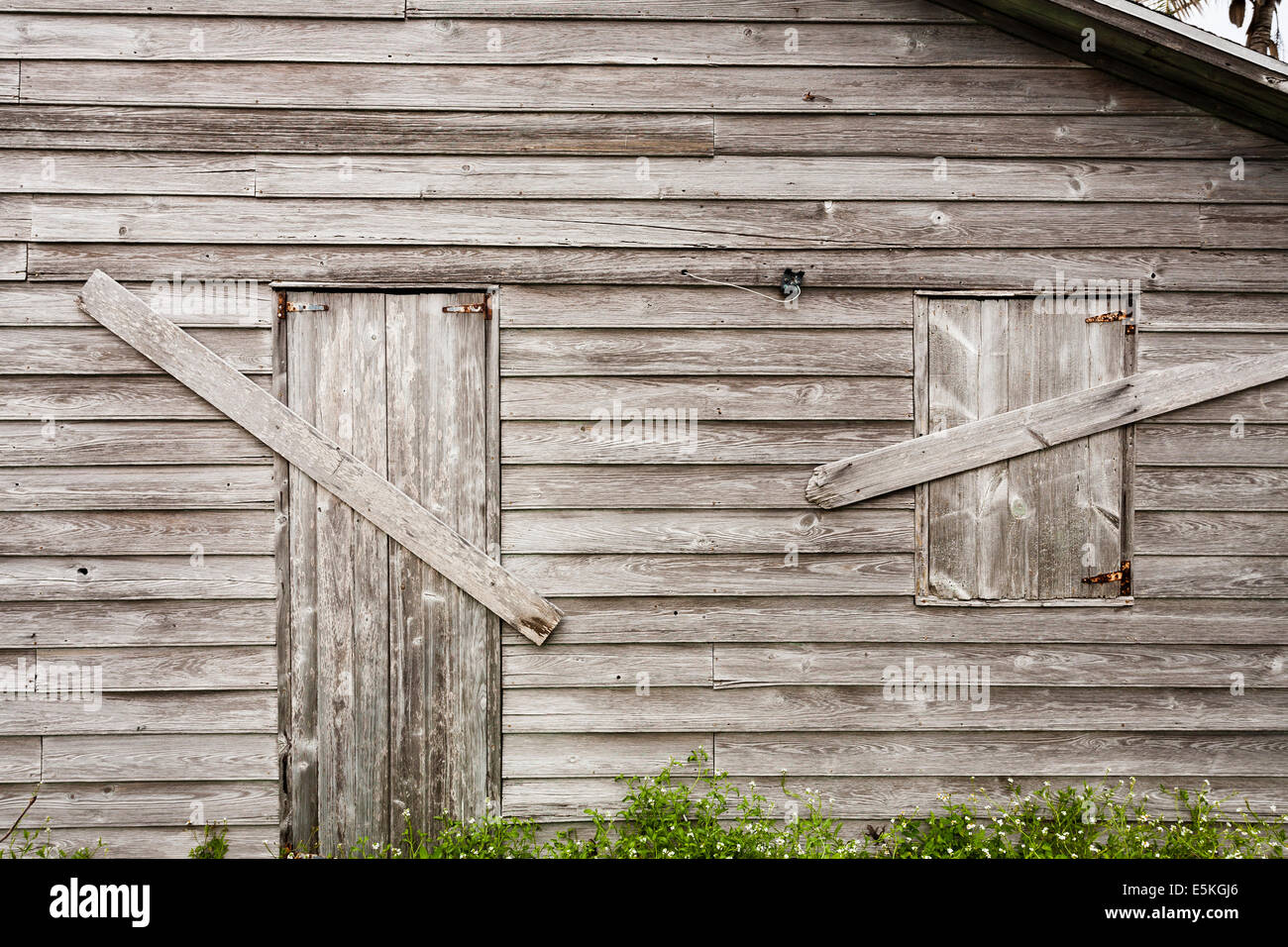 No Entry: a boarded up unpainted house in Hopetown. The side wall of a ...