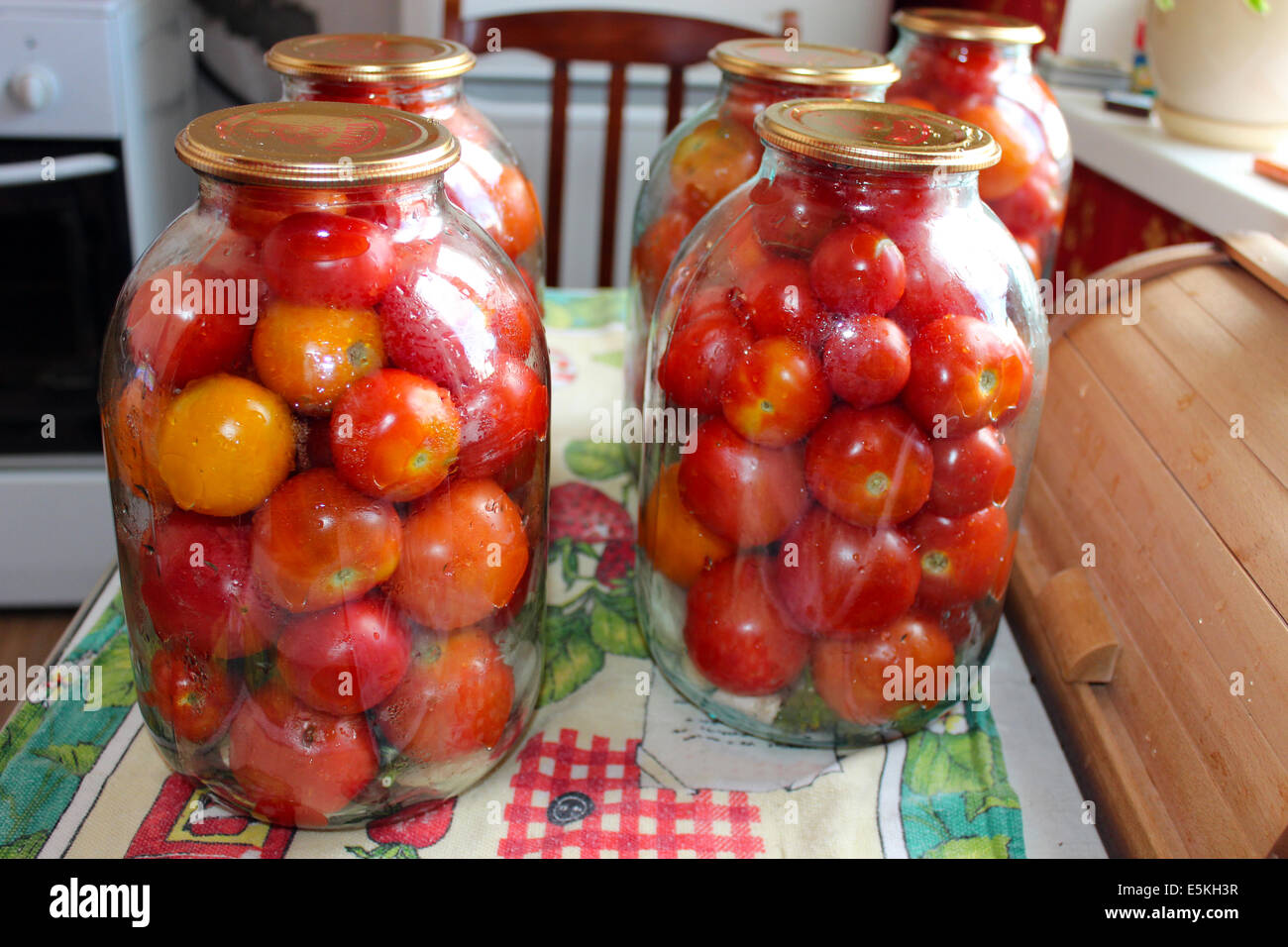 image of tomatoes in jars prepared for preservation Stock Photo - Alamy