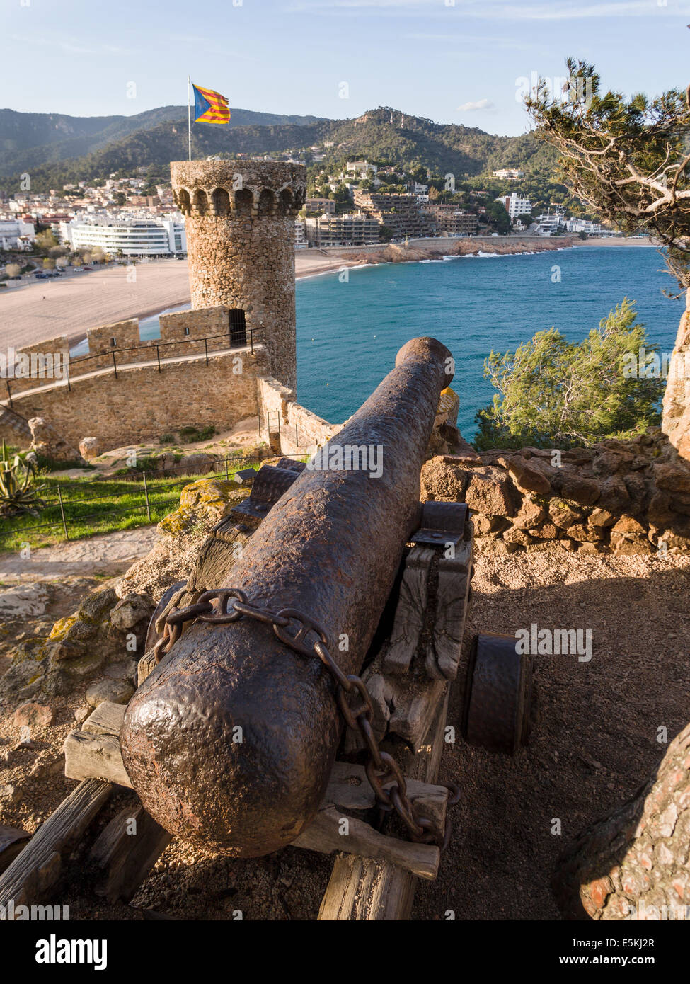 Rusty Cannon at Tossa de Mar Castle overlooking the sea. A cannon aimed ...