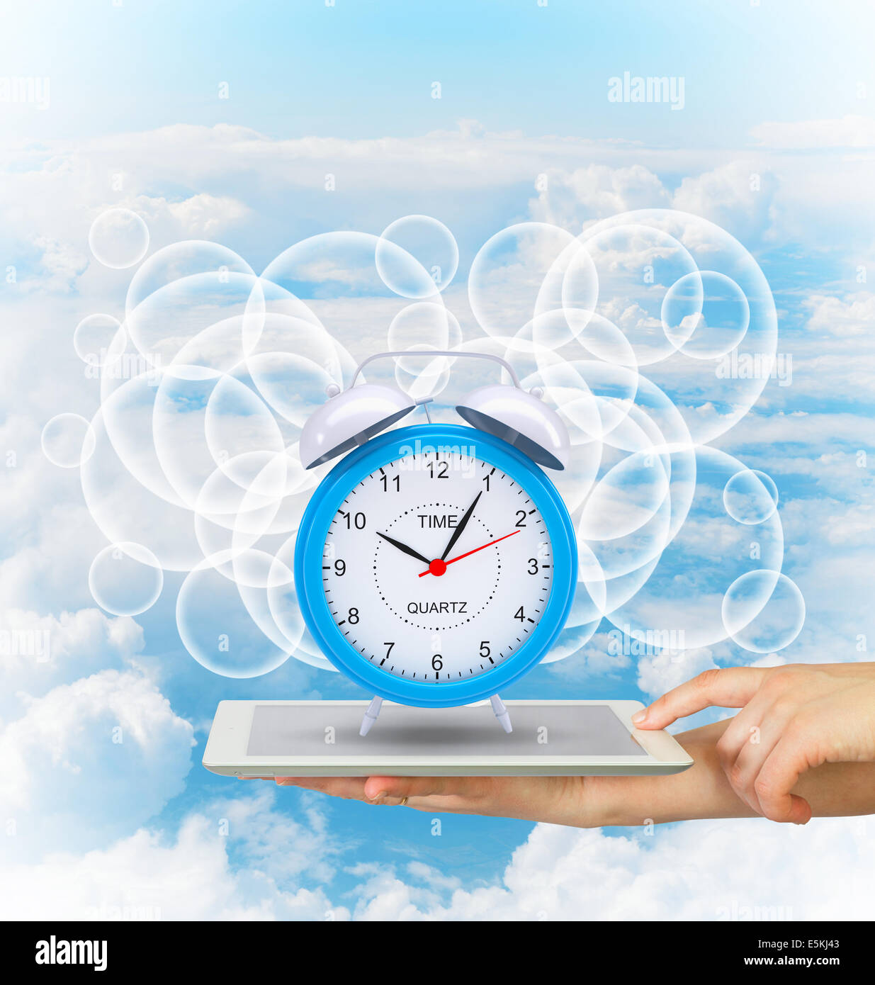Hands hold tablet pc with alarm clock Stock Photo - Alamy