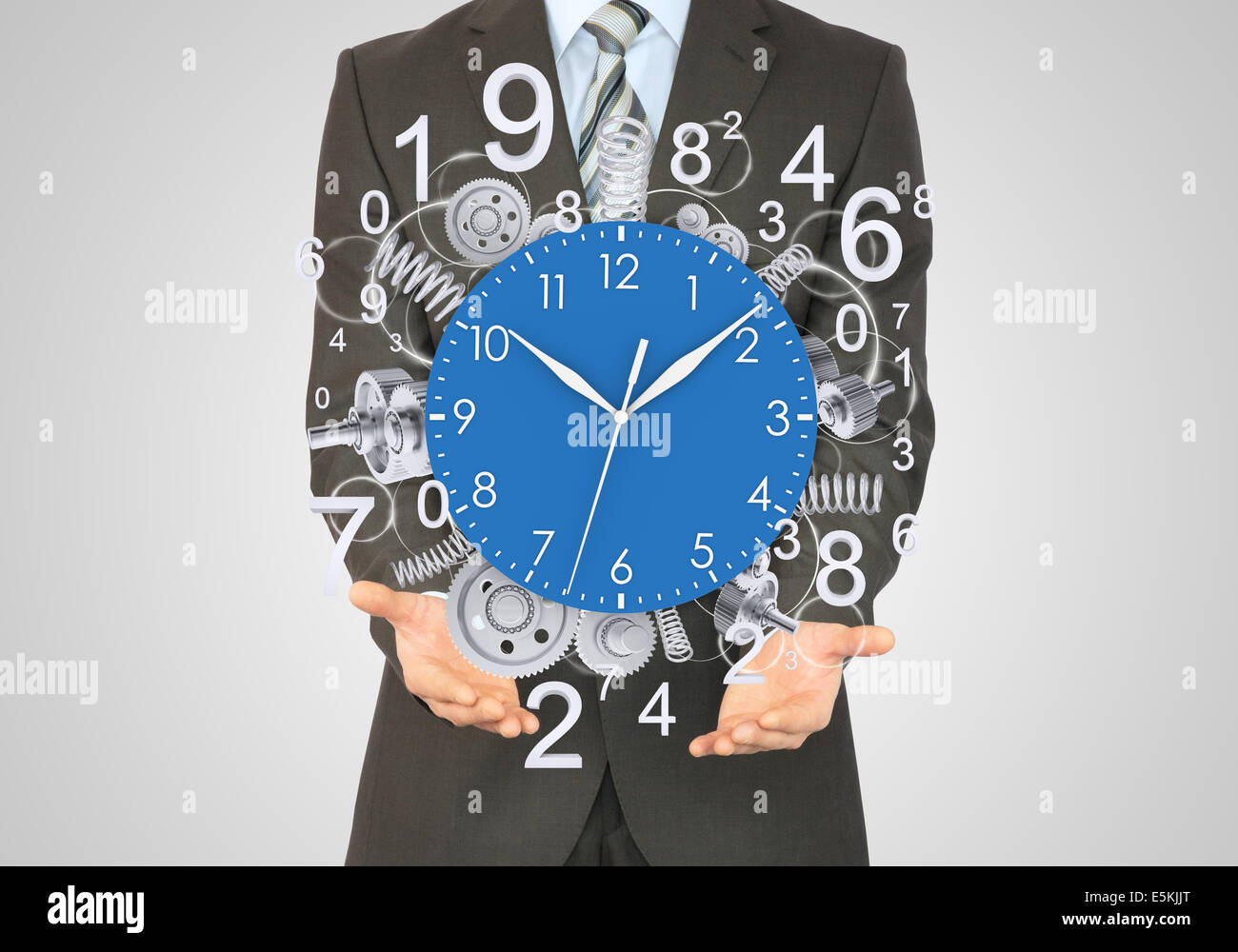 Businessman hold clock Stock Photo - Alamy