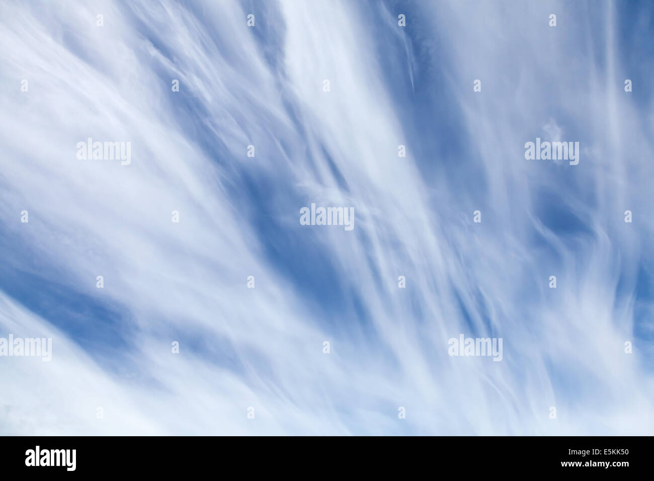 Windy clouds on blue sky. Background texture Stock Photo - Alamy
