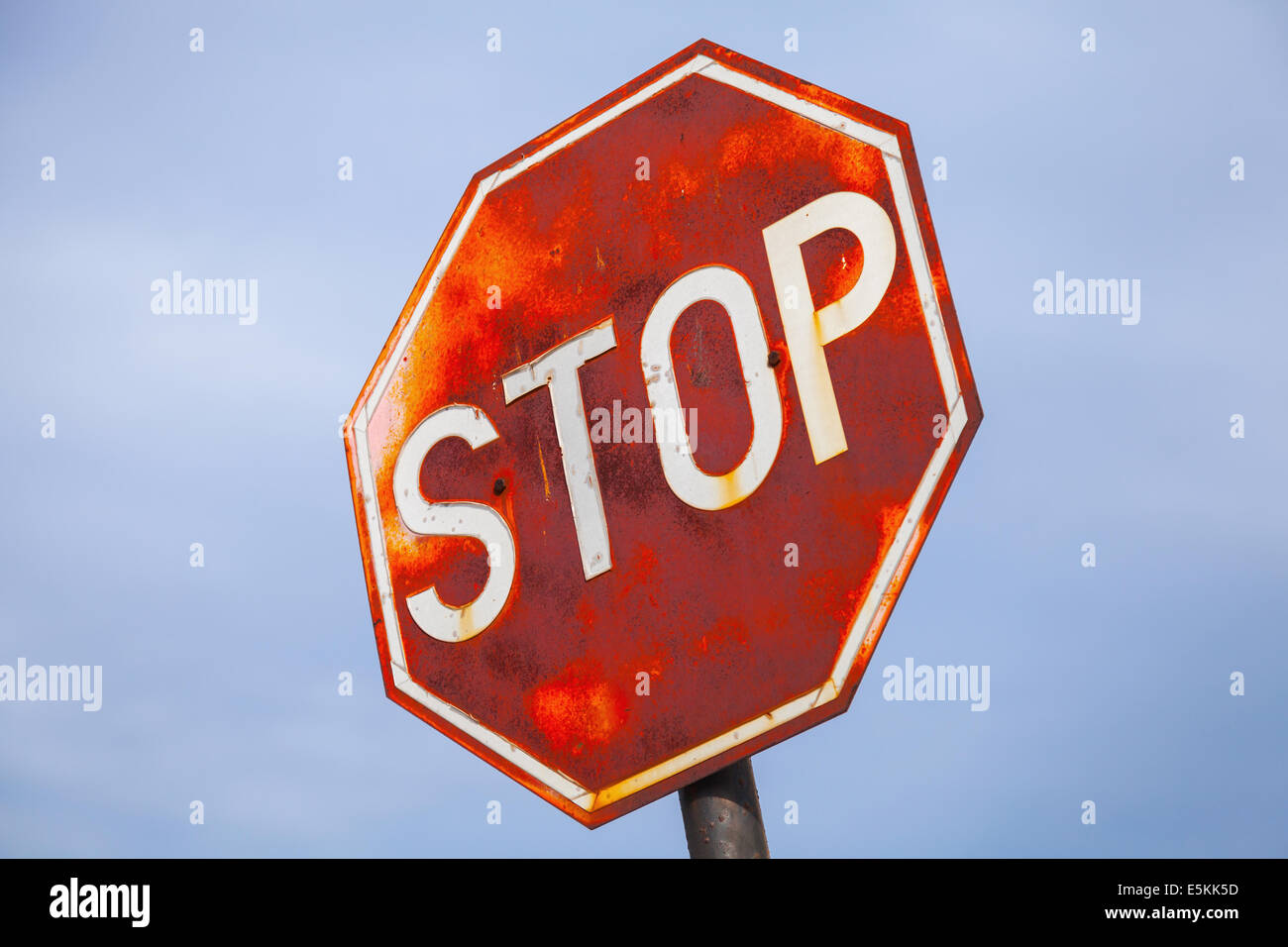 Old stop road sign above blue cloudy sky Stock Photo - Alamy