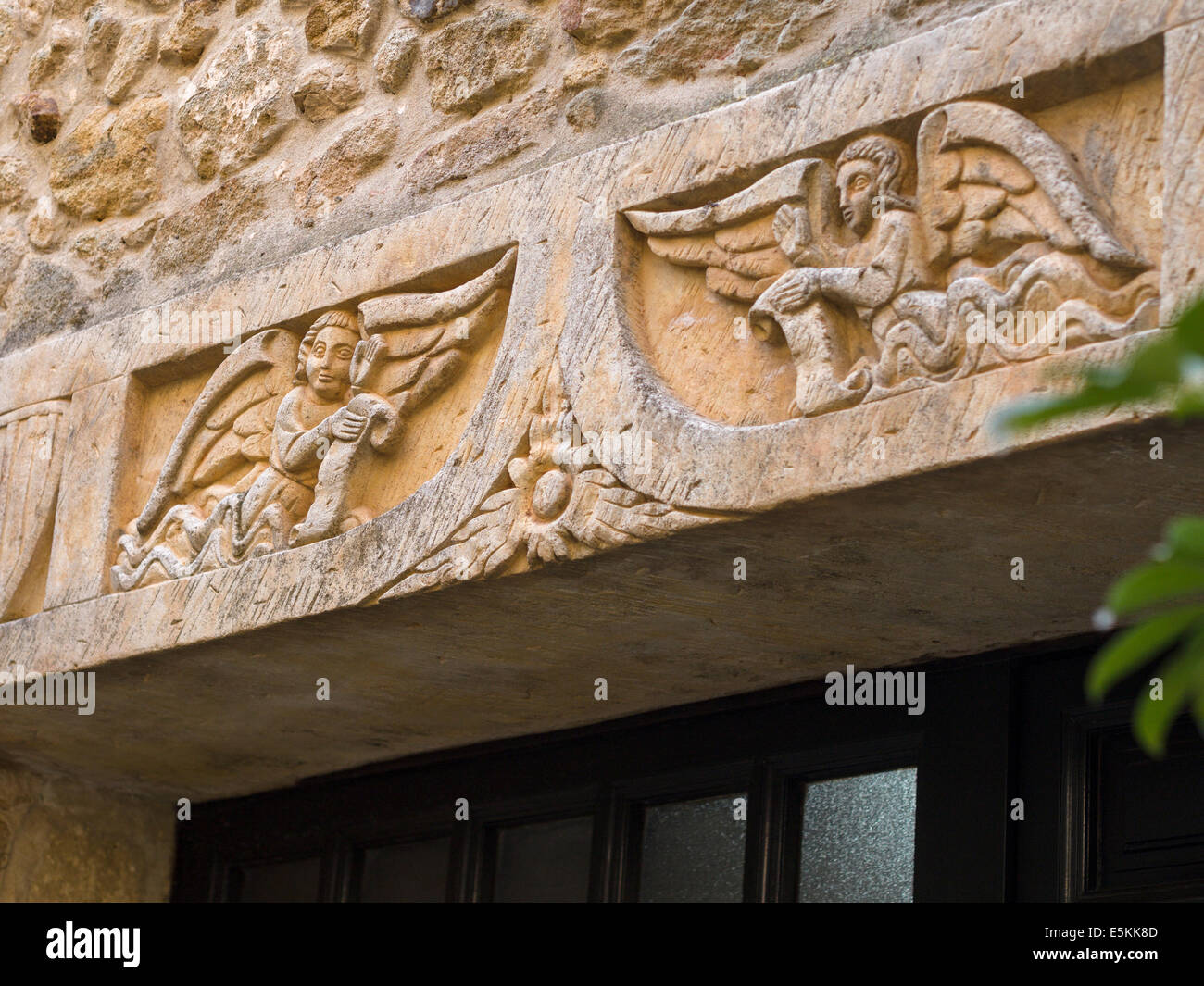 Detail of Angels above a Doorway. Angels carved into the lintel stone ...