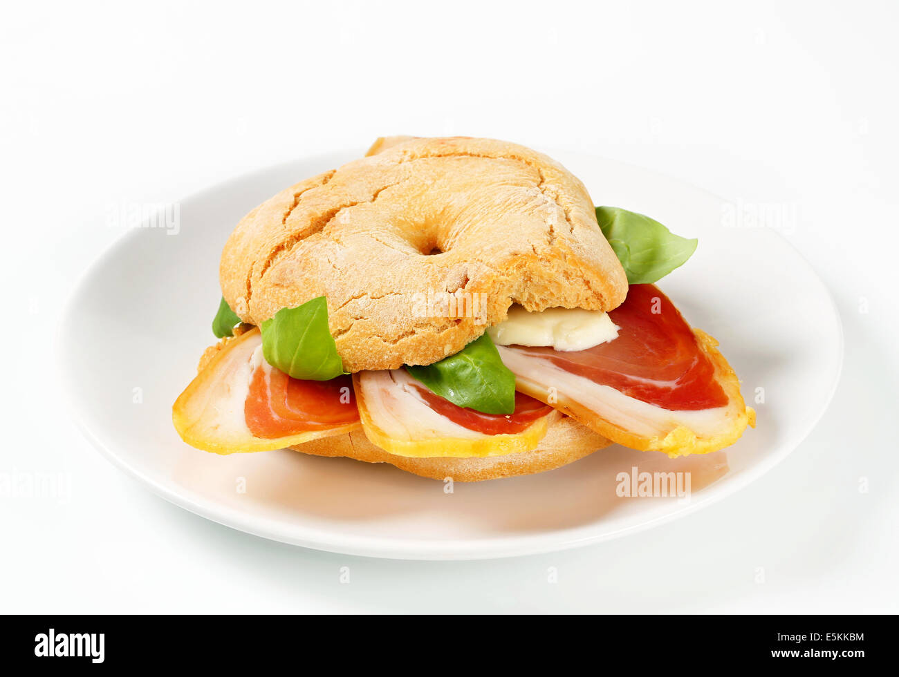 Ring-shaped roll with sliced prosciutto crudo and mozzarella Stock ...