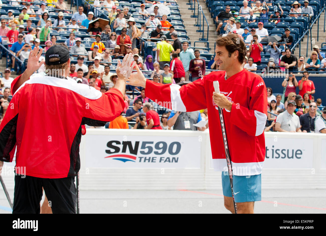 Toronto, Canada. 3rd Aug, 2014. Roger Federer (R) of Switzerland ...