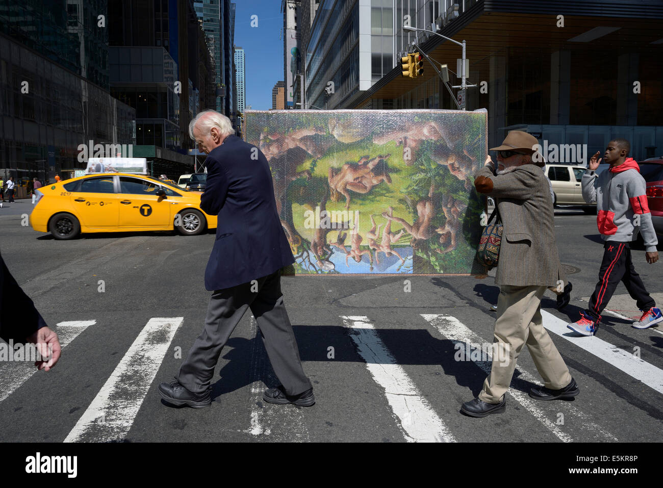 new york manhattan men carry painting Stock Photo - Alamy