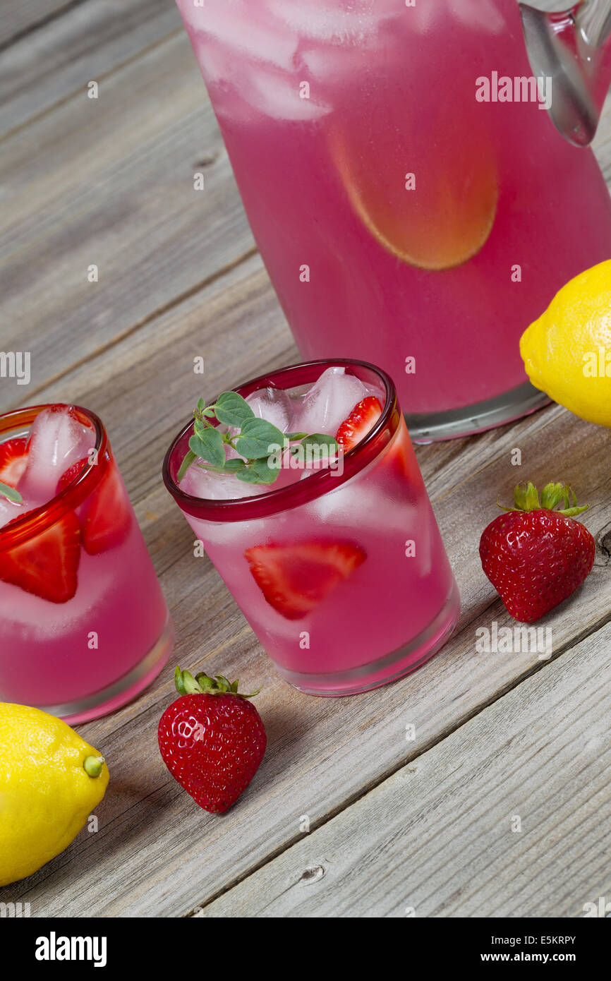 Vertical angled front view of a glass filled with freshly made pink ...