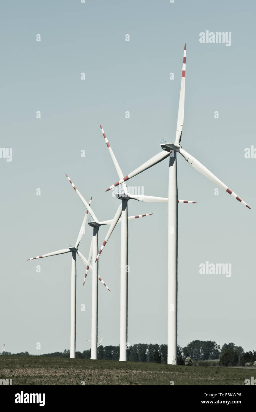 Wind turbine farm on rural terrain Stock Photo - Alamy