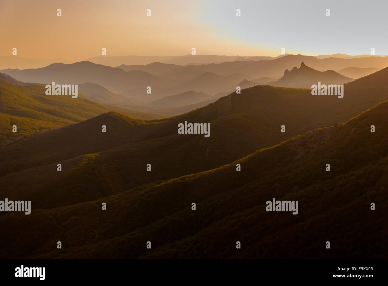 Sunset in the mountains, hills, forest, twilight Stock Photo - Alamy