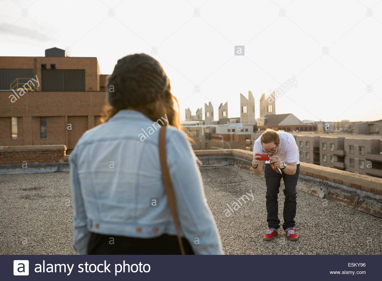 Man photographing woman hi-res stock photography and images - Alamy