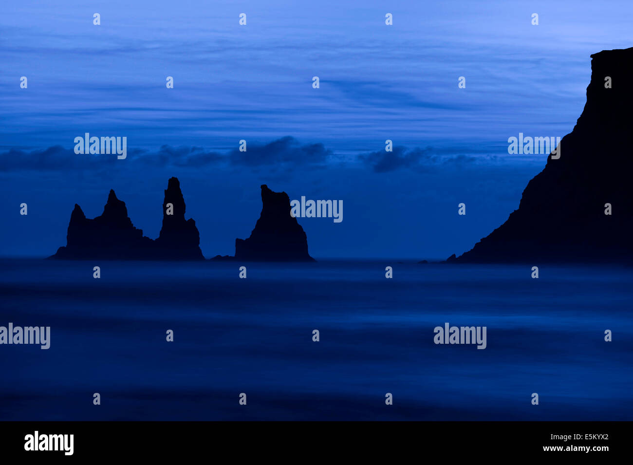 Reynisdrangar rocks in the sea, dusk, blue hour, Vik, Southern Region ...