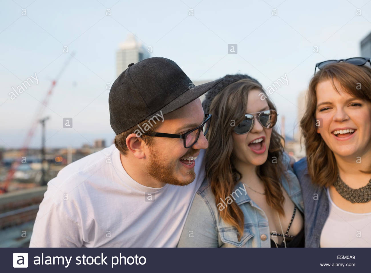 Men hanging around hi-res stock photography and images - Alamy