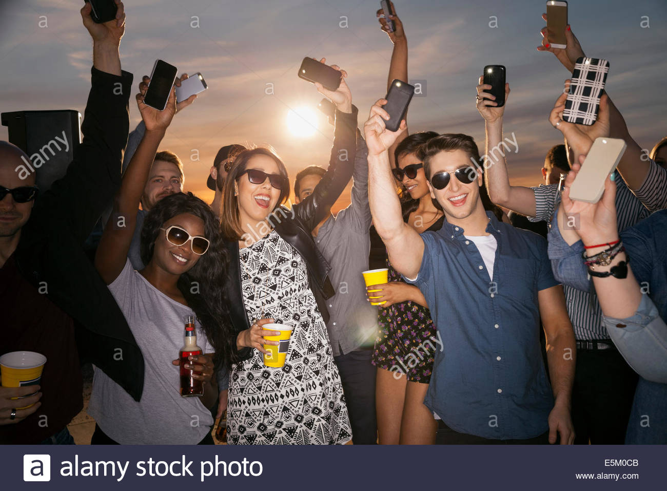 Man dancing holding up phone hi-res stock photography and images - Alamy