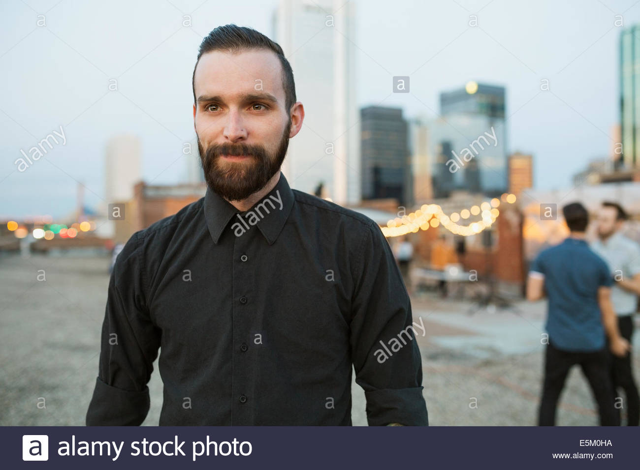 Man on rooftop hi-res stock photography and images - Alamy