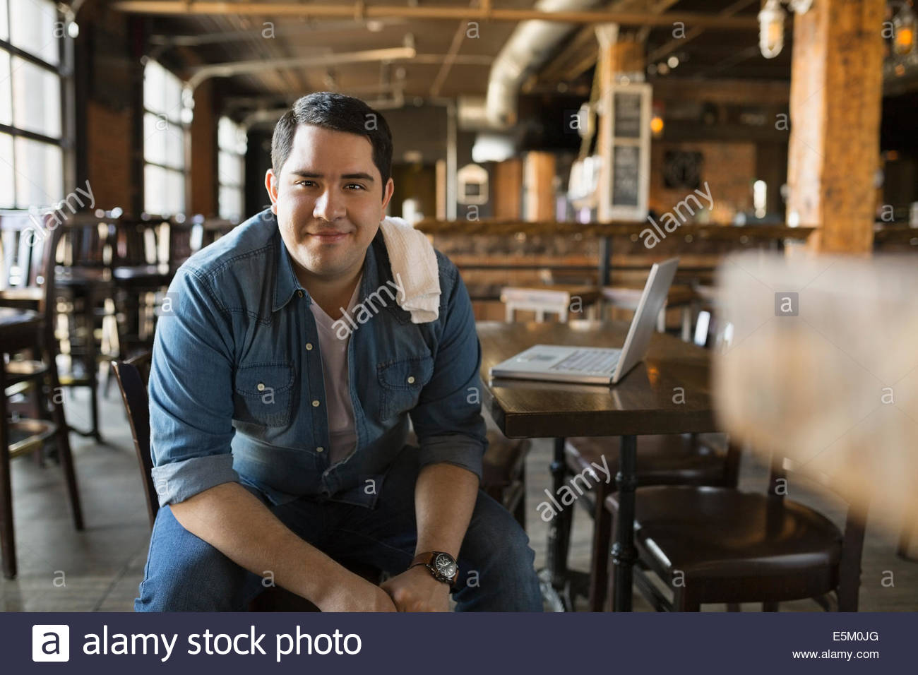 Portrait of smiling pub owner Stock Photo - Alamy