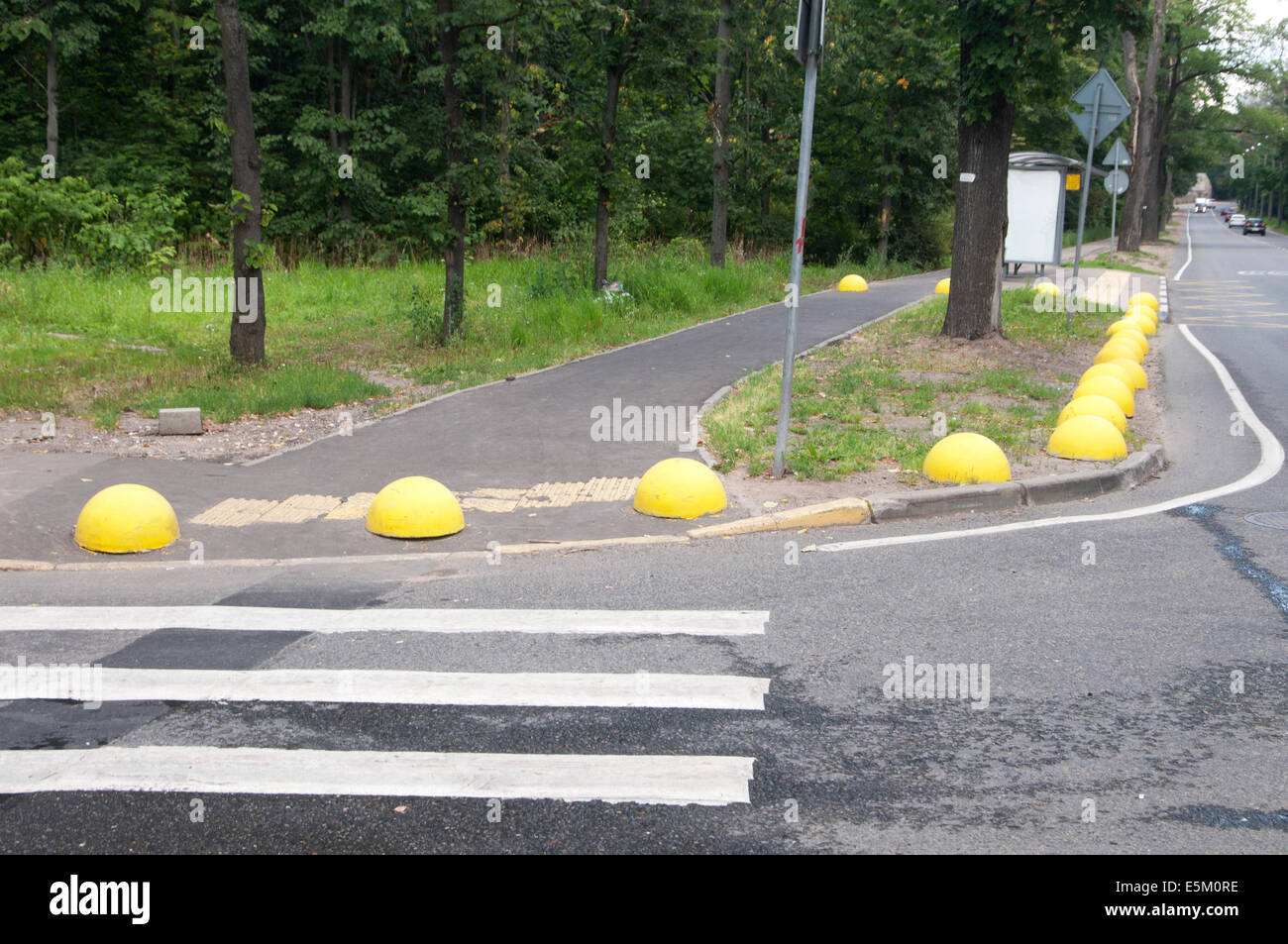 Parking barrier - concrete hemispheres, painted in yellow color Stock ...