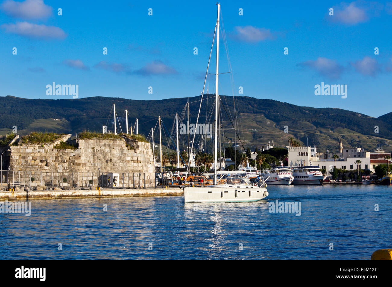 A yacht passing the Castle of the Knights of St. John, Neratzia, Kos ...