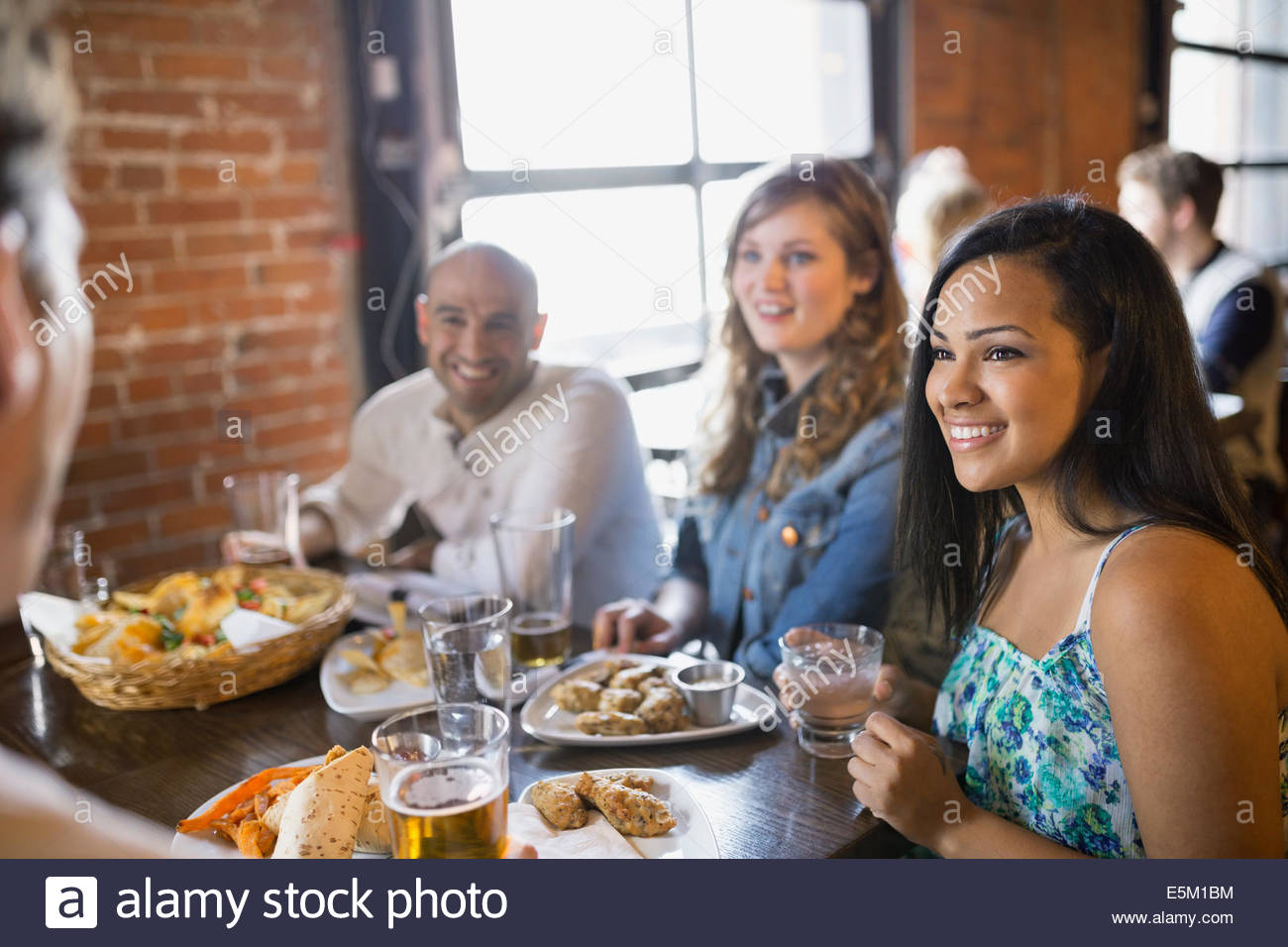 Three men eating together restaurant hi-res stock photography and ...