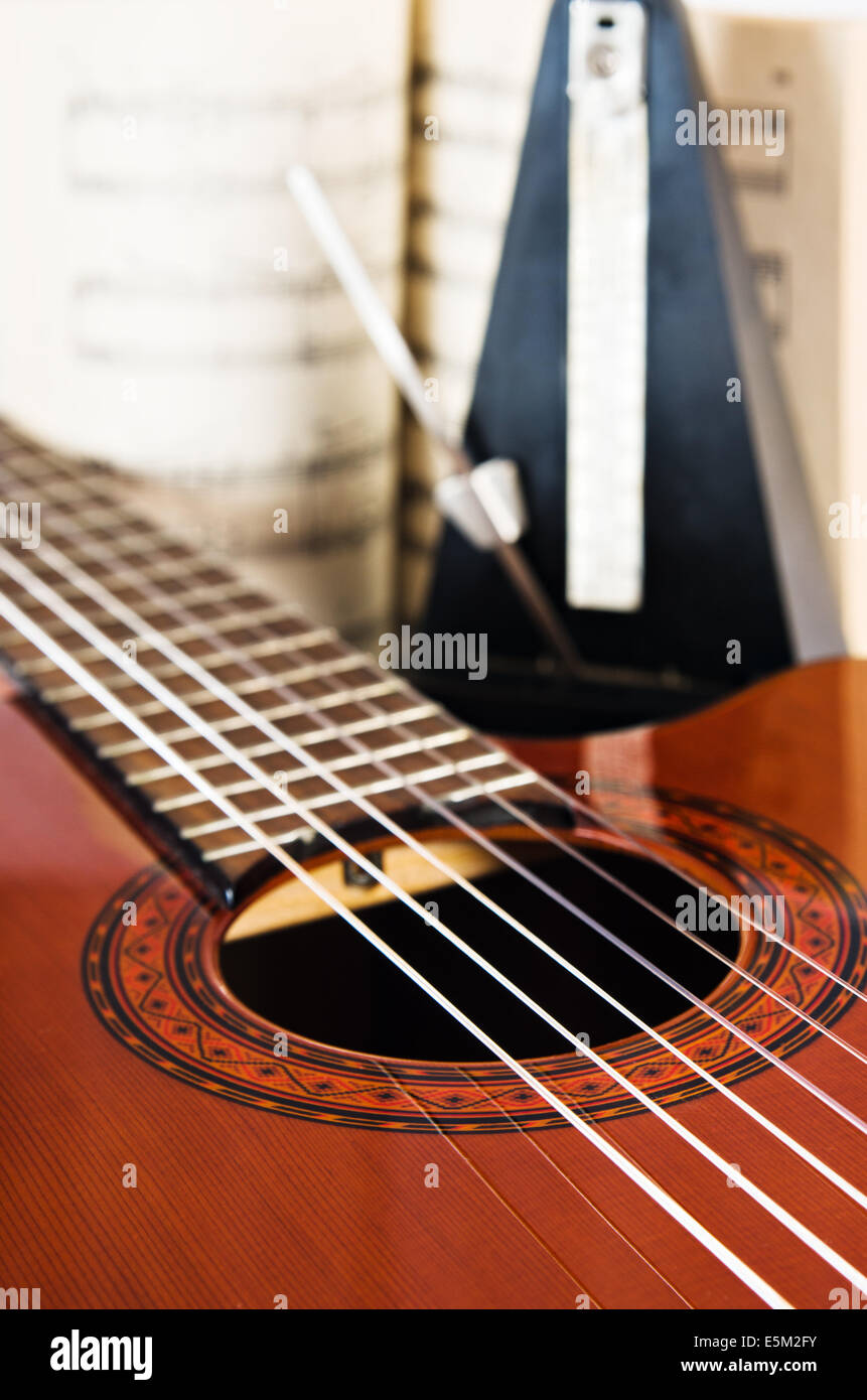 Strings of a guitar and the note Stock Photo - Alamy