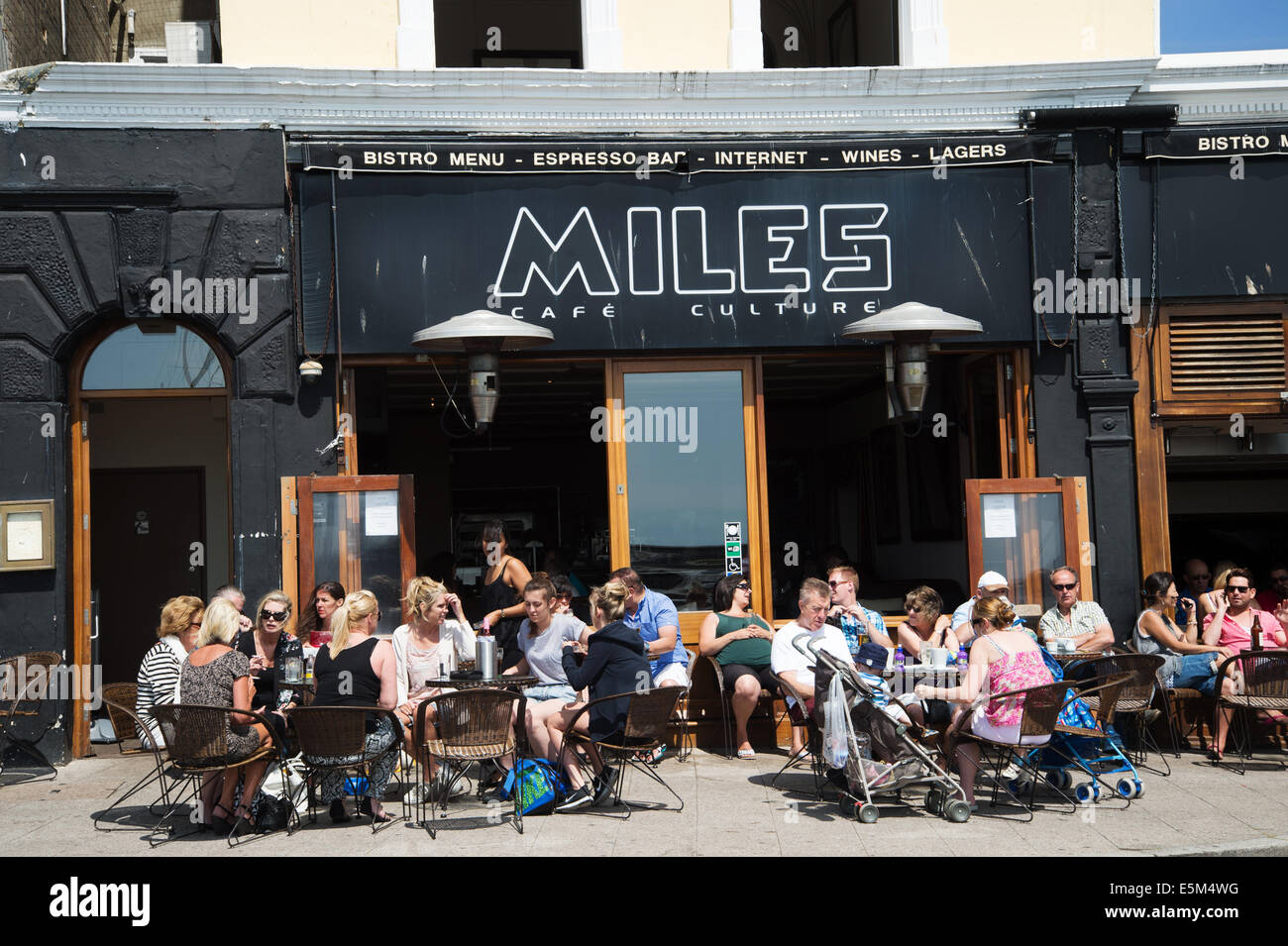 Ramsgate, Kent. Customers sit outside the cafe in the sunshine relaxing ...