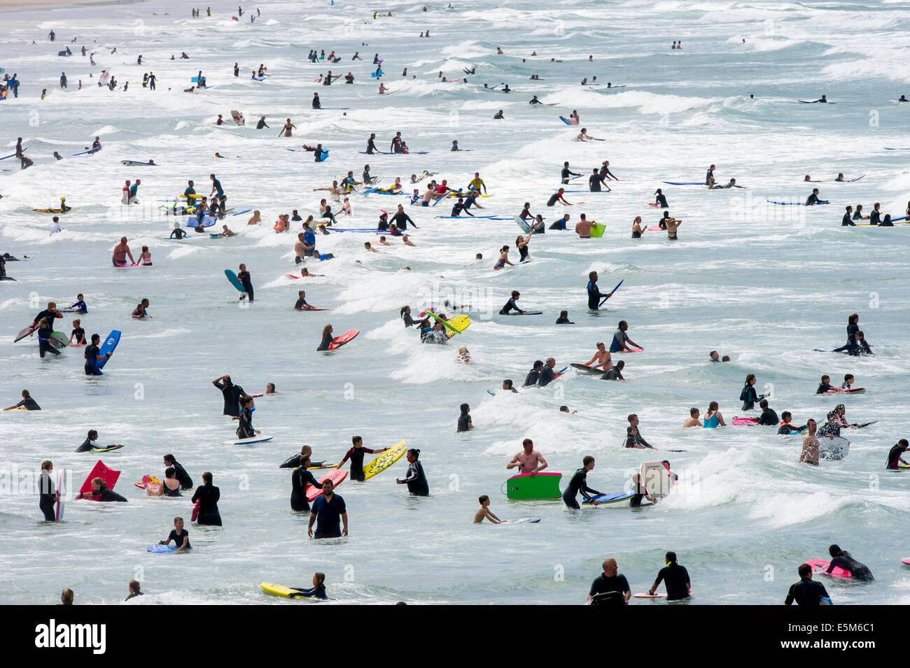 Mass of sunbathers on beach hi-res stock photography and images - Alamy