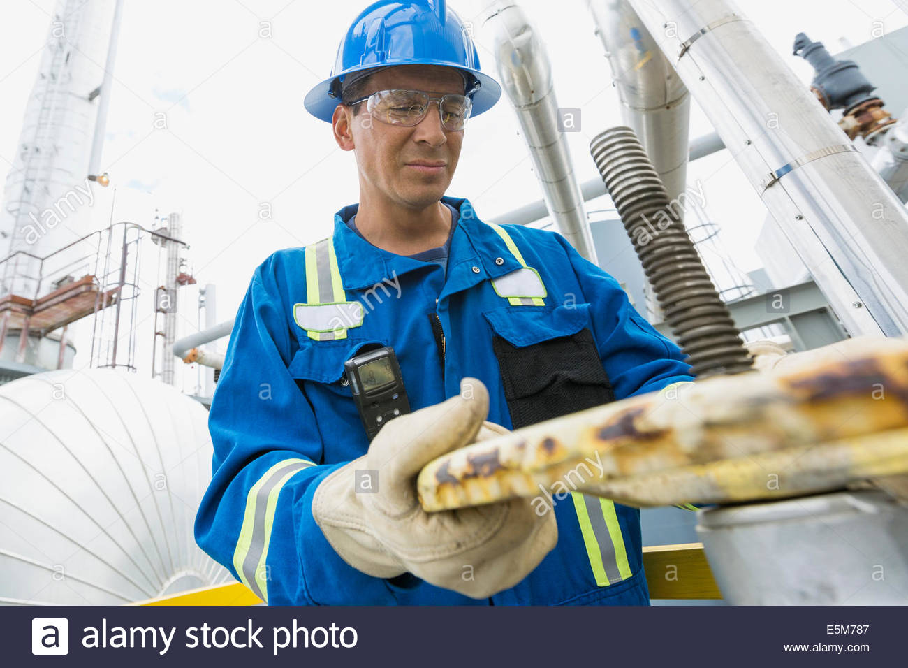 Men opening valve hi-res stock photography and images - Alamy
