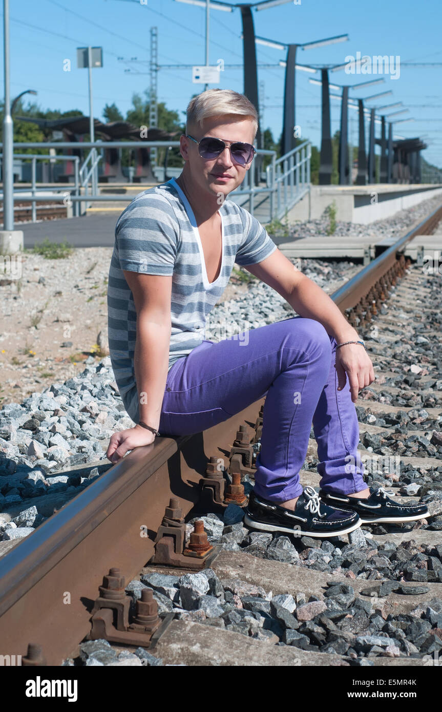 Attractive young guy on rails Stock Photo - Alamy