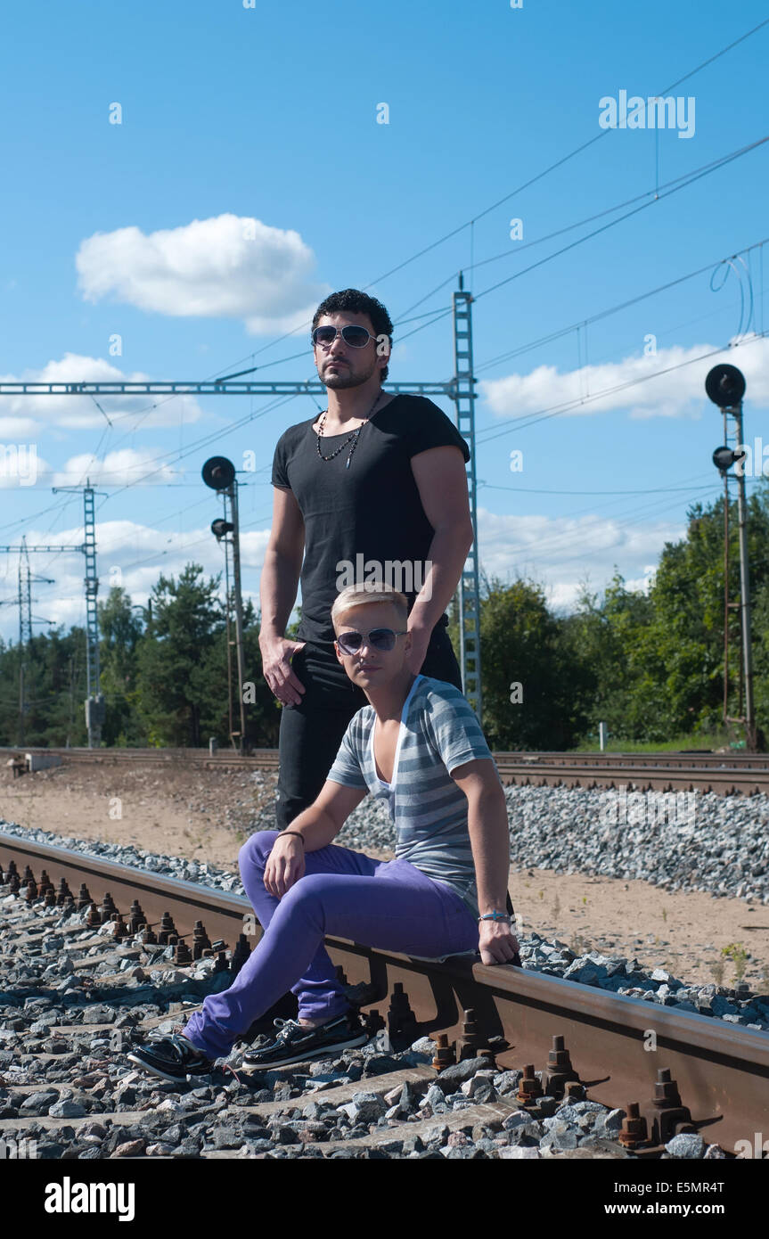 Attractive young man sitting on railroad hi-res stock photography and ...