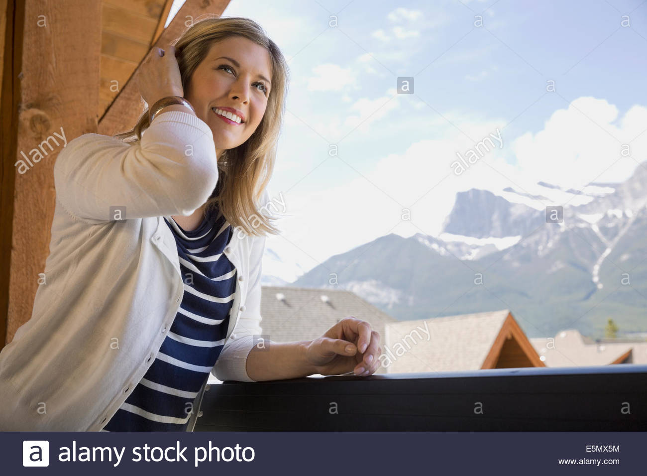 Lady on balcony hi-res stock photography and images - Alamy