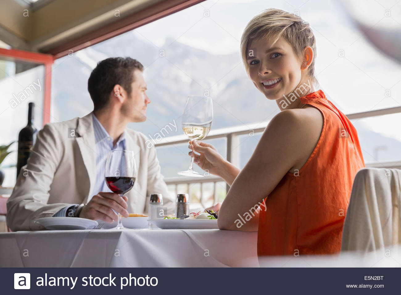 Women drinking alcohol table hi-res stock photography and images - Alamy
