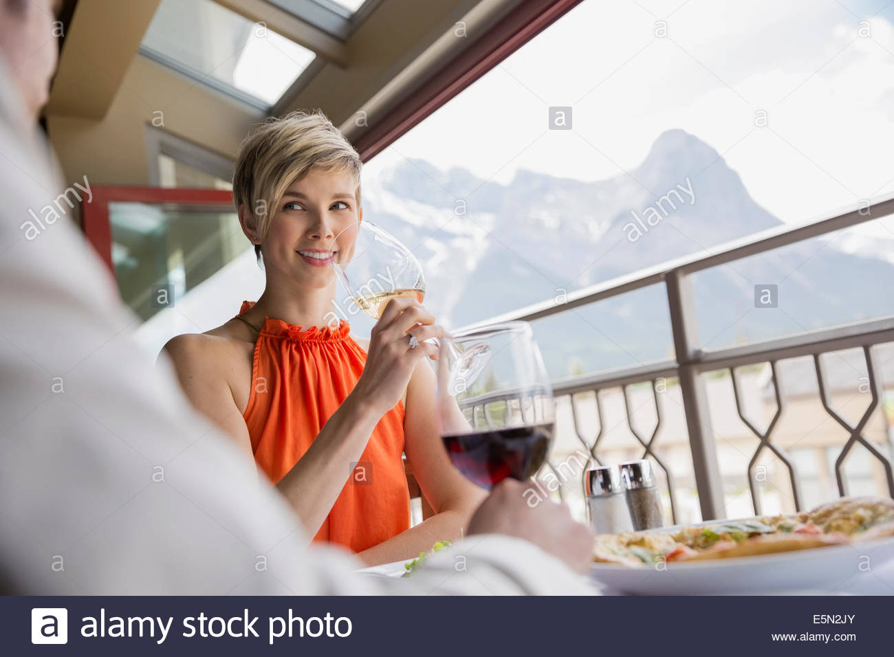 Women drinking alcohol table hi-res stock photography and images - Alamy