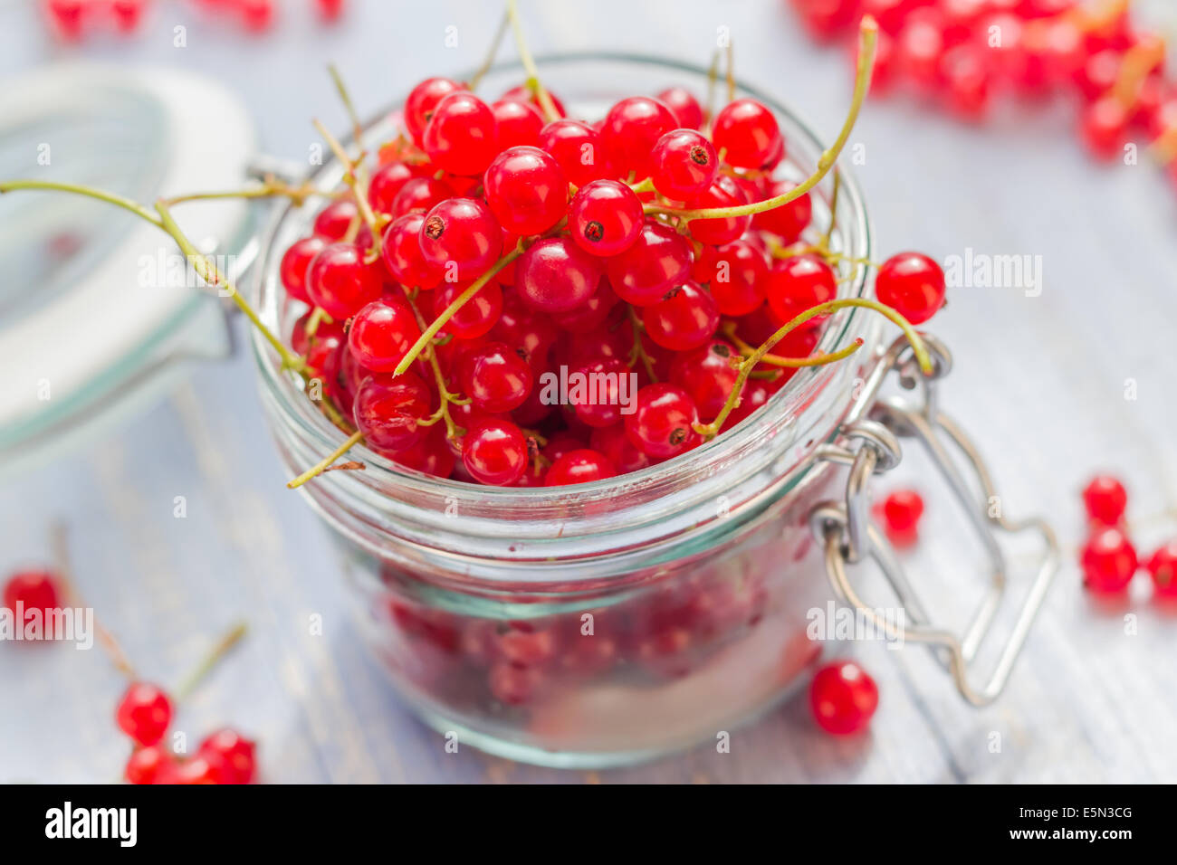 Preparation of products processed: fresh colorful summer fruits in jars ...