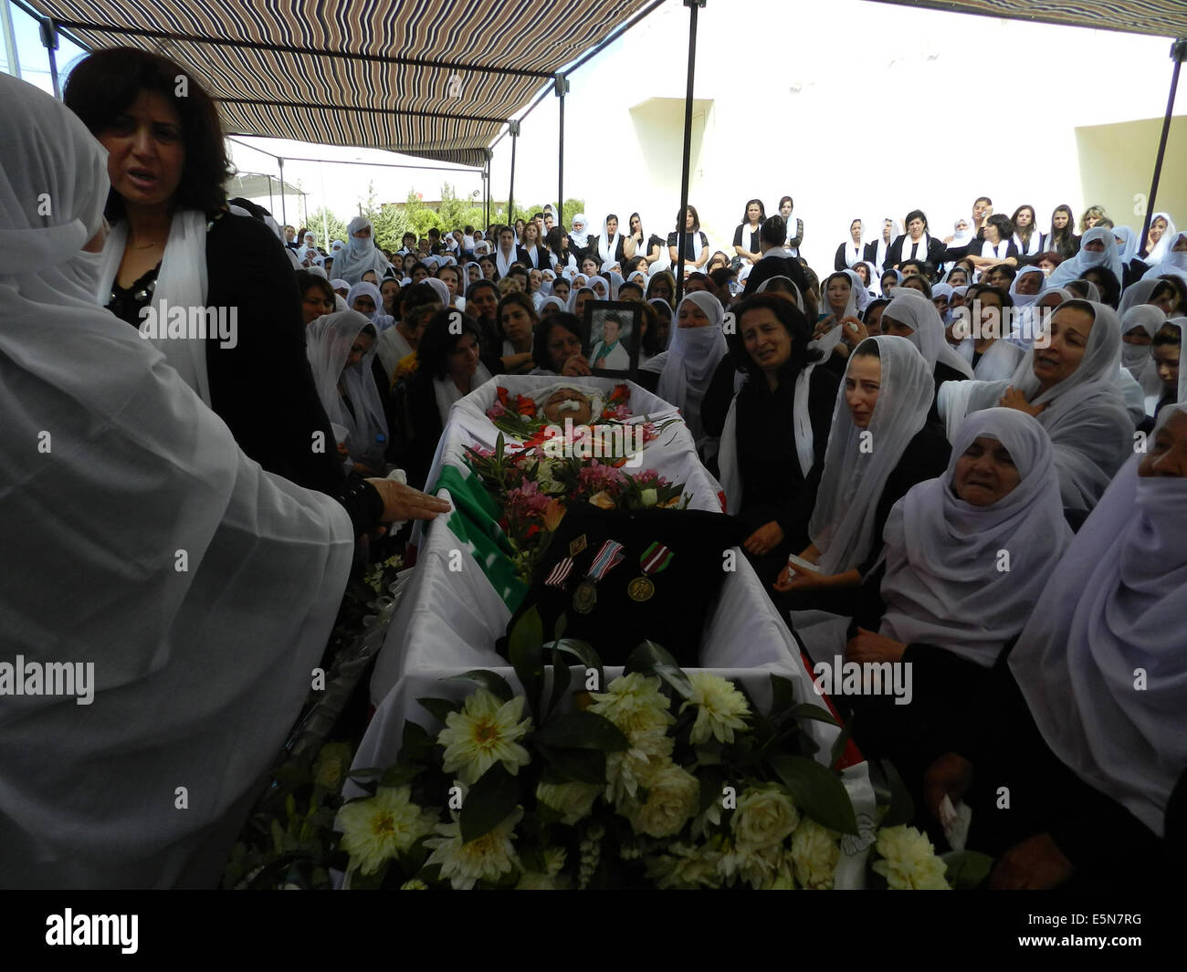 Beirut, Lebanon. 4th Aug, 2014. People attend funeral of a Lebanese ...