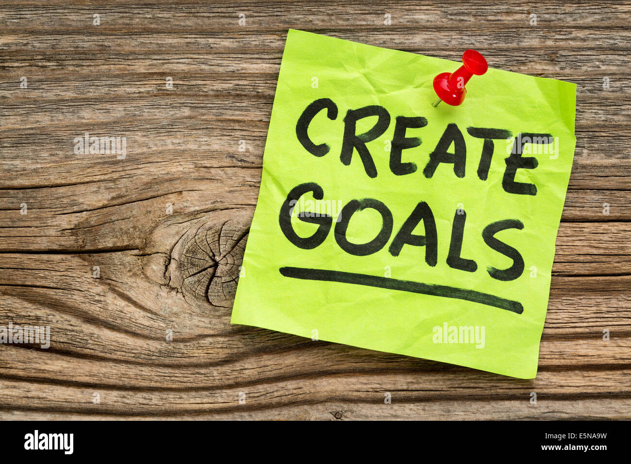 create goals reminder - handwriting on a green sticky note against ...