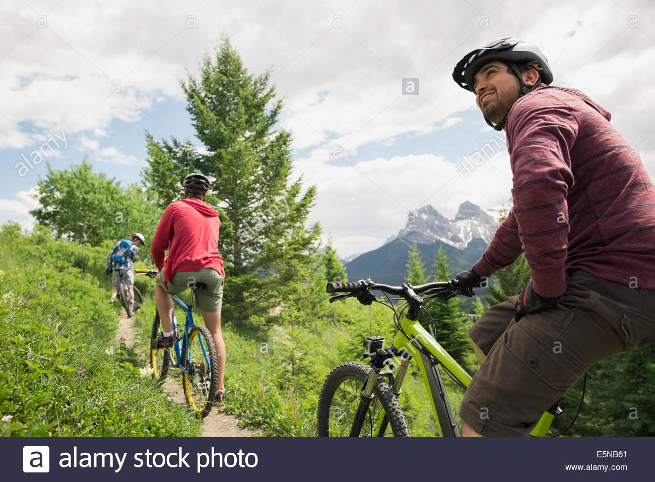 Men riding mountain bikes on trail Stock Photo - Alamy